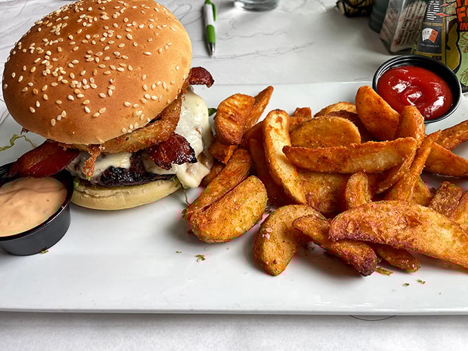 A burger that understands the assignment. Those wedge fries aren't sidekicks—they're co-stars in this delicious production of "Lunch: The Musical."