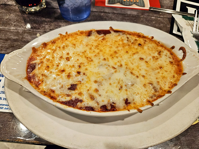Bubbling cheese blankets create a golden canopy over what might be the world's most comforting baked pasta—spoon-ready and soul-satisfying.