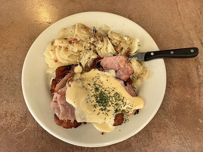 Schnitzel perfection topped with ham and melted cheese&mdash;proof that sometimes the best cultural exchanges happen on a dinner plate.