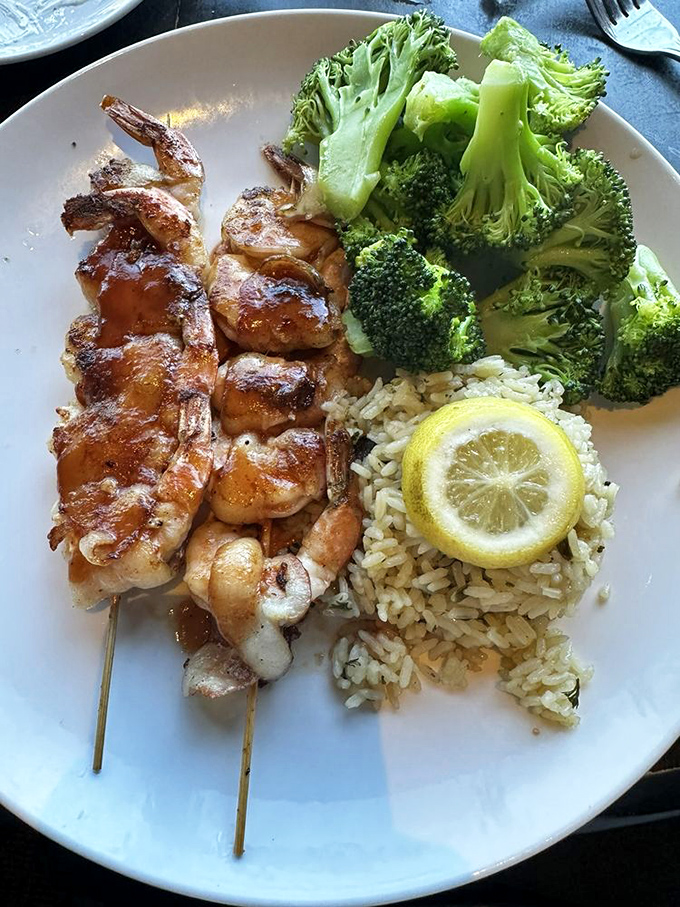 These bacon-wrapped shrimp skewers aren't just appetizers&mdash;they're proof that sometimes the best things in life come on sticks.