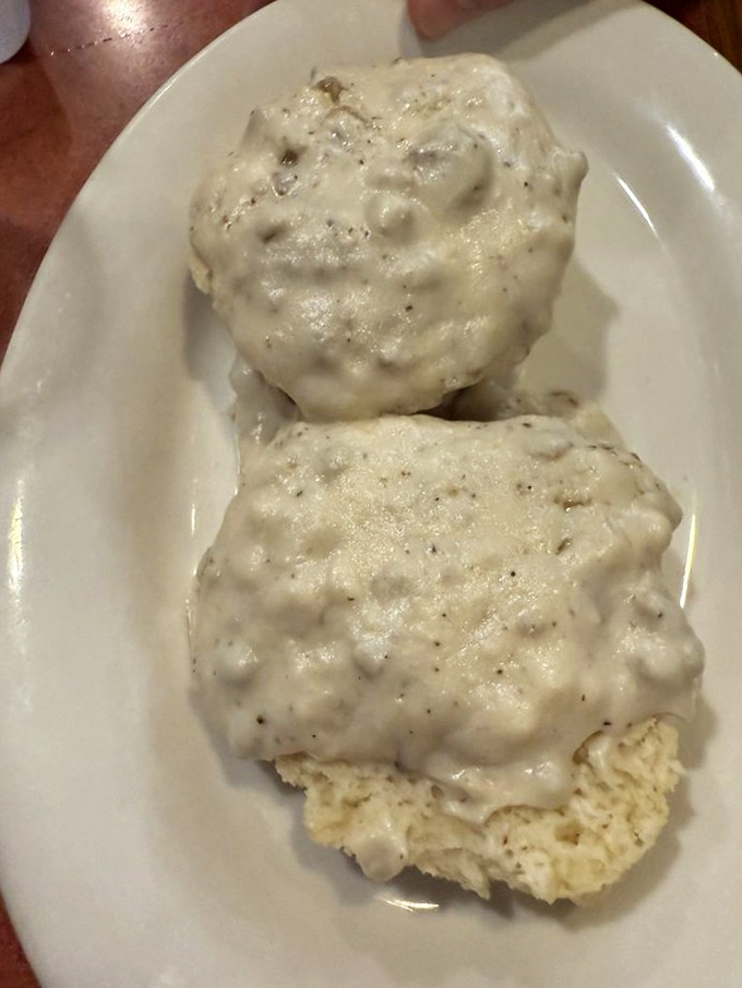 Biscuits drowning in creamy gravy represent Southern comfort food at its most soul-satisfying, indulgent best. 