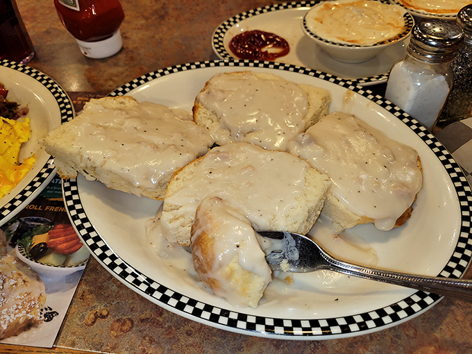 Biscuits bathed in creamy gravy that would make your Southern grandmother nod in approval&mdash;carbs and comfort in perfect harmony.