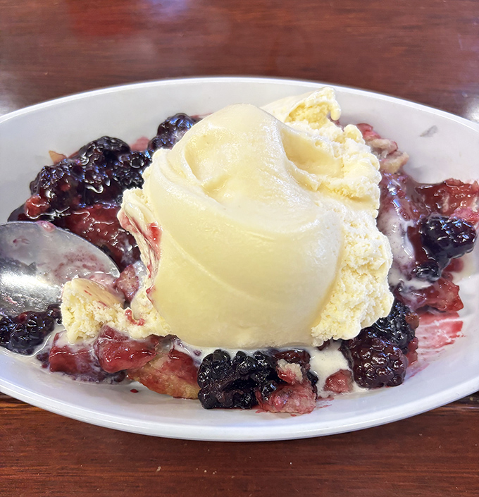 Berry cobbler with ice cream that melts into warm fruit&mdash;the kind of dessert that makes you consider licking the plate when nobody's looking.