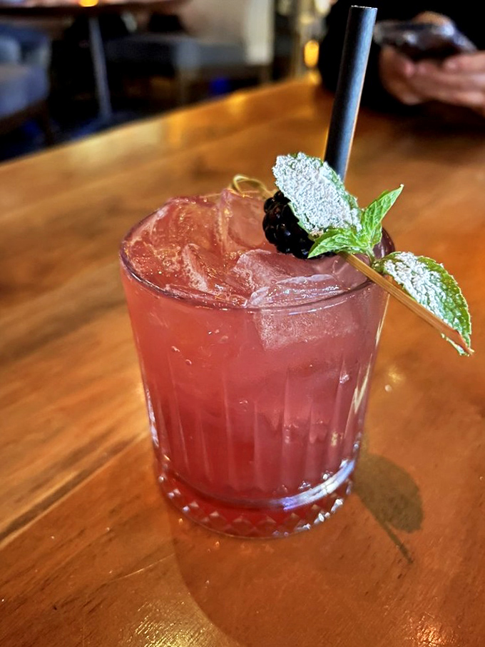 This isn't just a cocktail&mdash;it's a refreshing escape in a glass, garnished with fresh berries and mint for that perfect California twist.