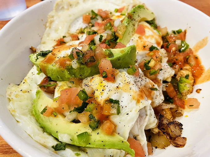 Breakfast gets a vacation in this bowl—eggs mingling with avocado and pico de gallo like they're all at a delicious beach party.