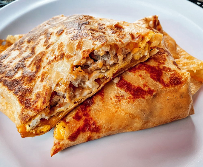 Breakfast crepes folded like edible origami. The golden exterior hides a treasure of savory fillings that would make any French chef nod approvingly.