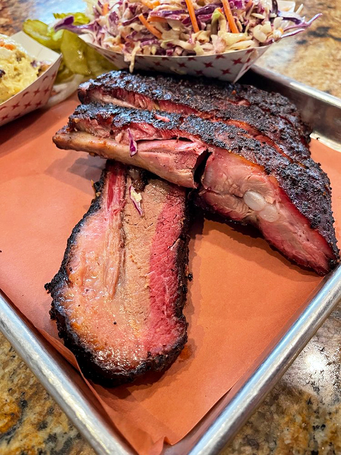 These ribs showcase the hallowed smoke ring&mdash;that pink evidence of low-and-slow cooking that makes barbecue enthusiasts weak in the knees.