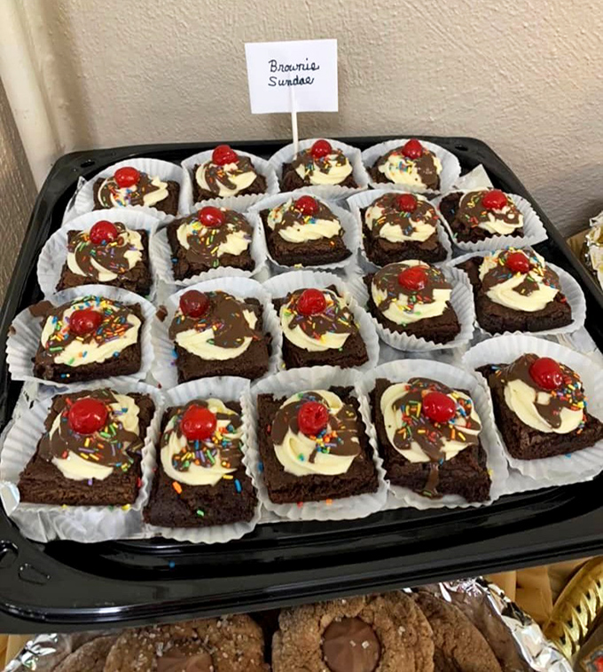 Brownie sundaes with personality! Each one topped with a cherry sentinel standing guard over cream, chocolate, and sprinkles.