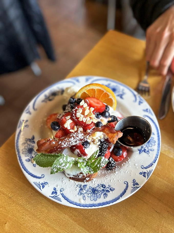 French toast elevated to an art form &ndash; where berries, powdered sugar, and maple syrup create a breakfast symphony.