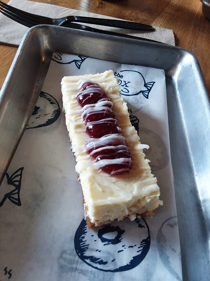 This cheesecake bar with jam swirl isn't just dessert—it's edible therapy. The kind your insurance definitely doesn't cover.