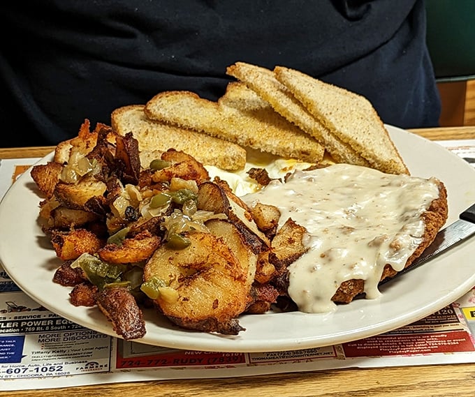 Country-fried steak with gravy &ndash; where breakfast meets comfort food in a plate-sized hug that says "everything's gonna be alright today."
