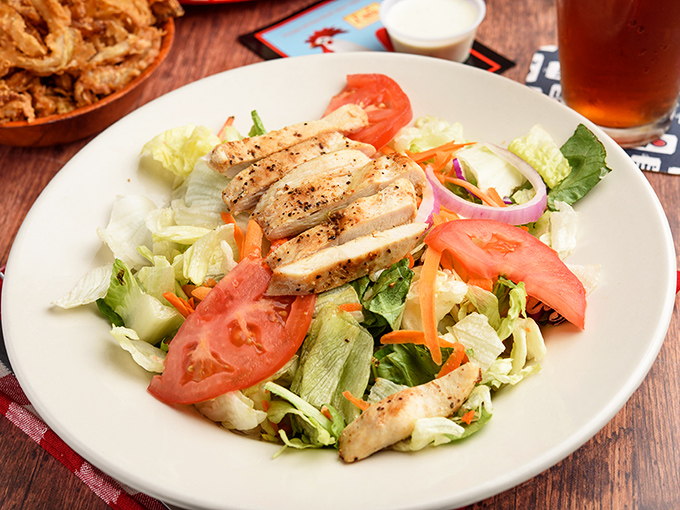A lighter option that doesn't sacrifice flavor &ndash; grilled chicken atop fresh vegetables for those rare moments when you're being "good."