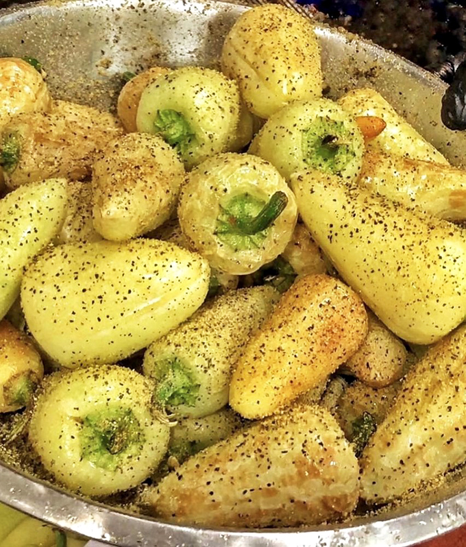 Fire-roasted chiles toreados bring the heat and smoky depth that serious spice lovers crave in every bite. 