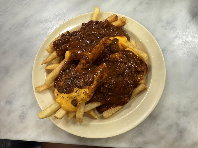 Fries baptized in chili and cheese&mdash;a holy trinity of comfort that makes you forget about things like "moderation" and "cholesterol."