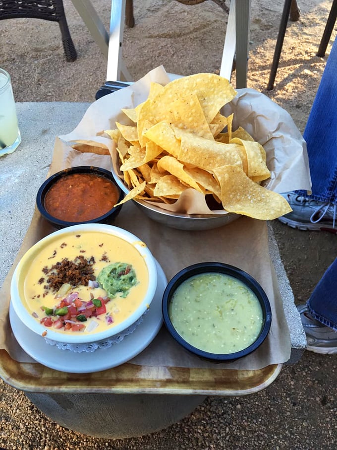 Chips and queso: the unofficial Texas handshake. Three distinct dips create a choose-your-own-adventure of flavors for each crispy triangle.