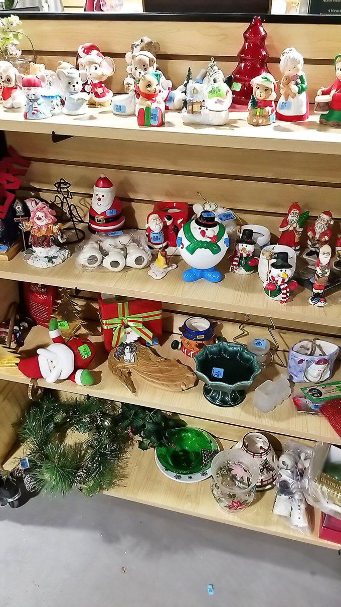 Holiday figurines stand at attention, ready for their second act in new homes. These ceramic Santas and snowmen have stories from holidays past.