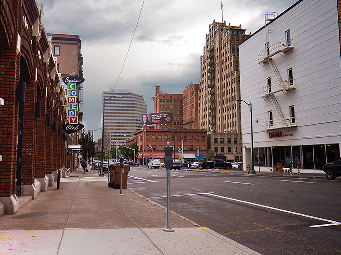 Historic buildings line Spokane's walkable streets, where signs like the Comedy Club marquee remind you that laughter is still affordable in this unpretentious city.