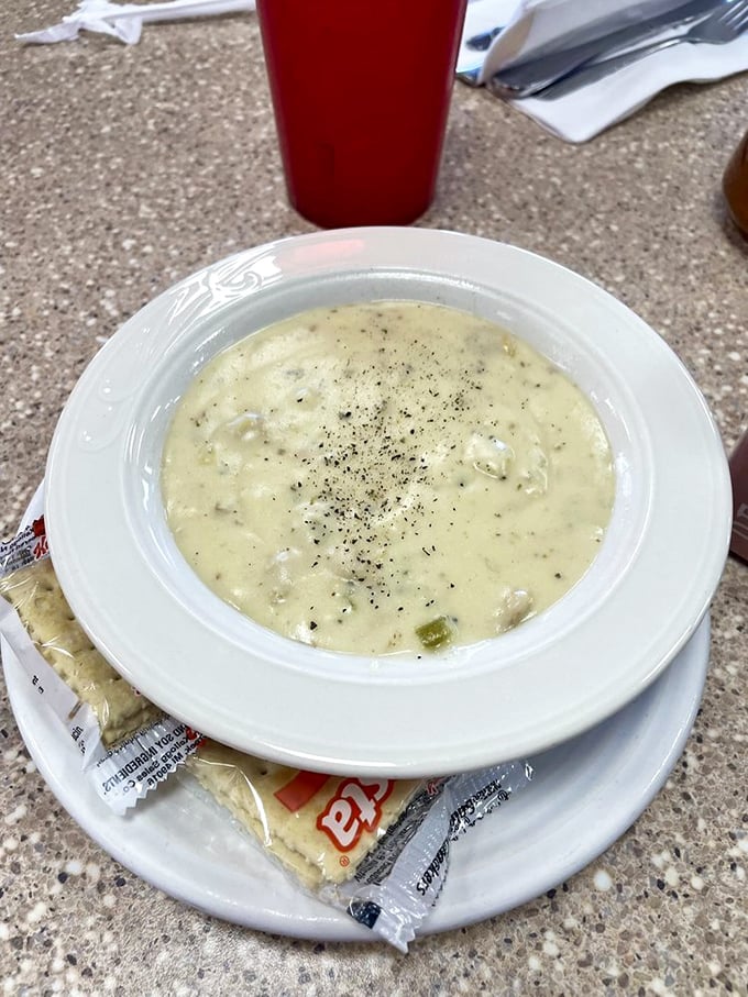 Clam chowder thick enough to stand a spoon in, with packets of crackers standing by for dunking duty. Soup that demands to be taken seriously.