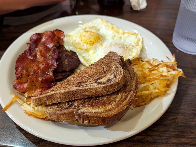 Breakfast fundamentals executed with precision&mdash;crispy bacon, perfectly fried egg, golden toast, and those hashbrowns that somehow improve everything they touch.