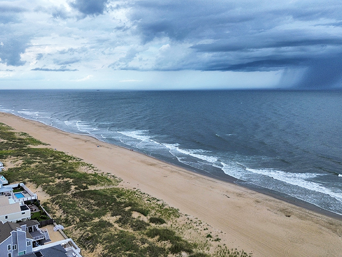 Storm clouds gathering over Sandbridge's coast create nature's drama&mdash;part threatening, part breathtaking, entirely worth watching from your covered porch.