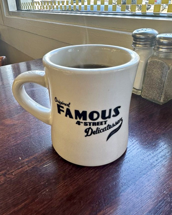The coffee mug says "Famous" because it knows something you don't – this isn't just caffeine, it's liquid tradition in ceramic form.