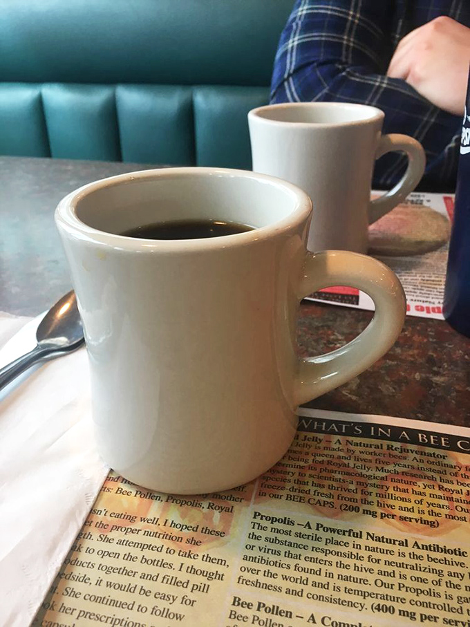 The sturdy white mug&mdash;diner coffee's natural habitat&mdash;where refills appear magically and conversations stretch longer than intended.