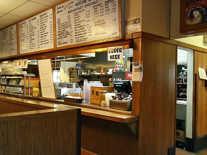 The ordering counter&mdash;where breakfast dreams begin their journey from menu board to magnificent reality. 