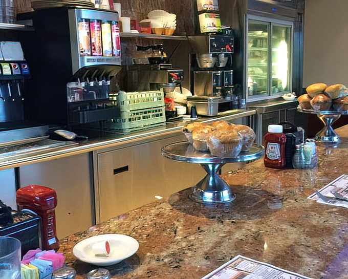 The counter area &ndash; command central for coffee refills and pastry temptations, where regulars exchange local gossip over steaming mugs.