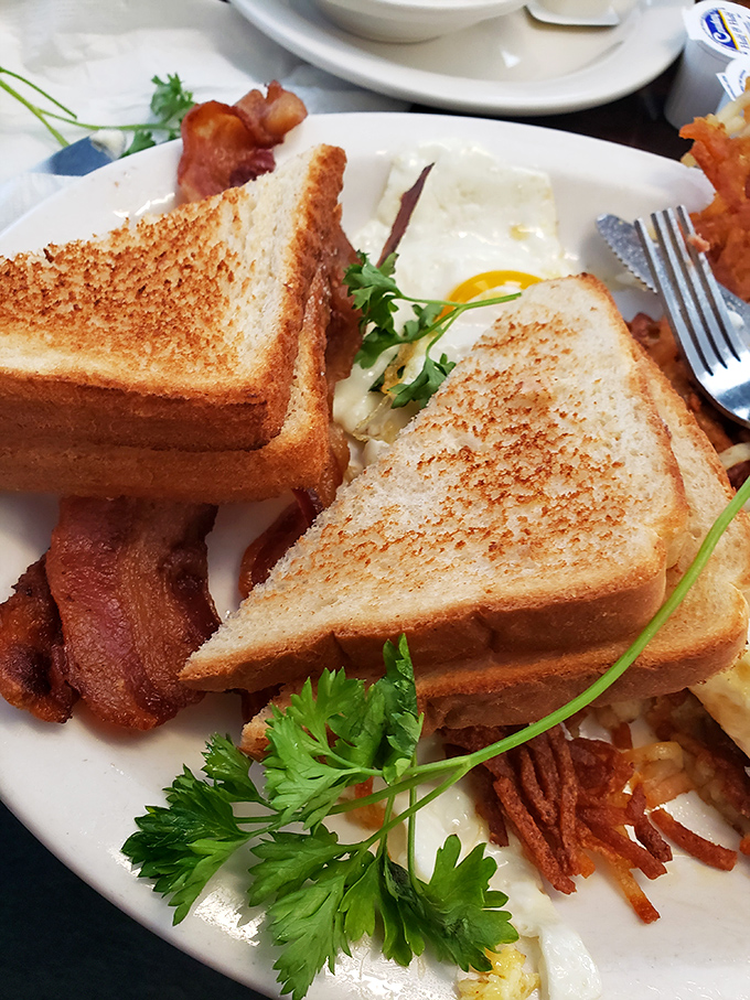 Toast standing at attention, bacon at the ready, and eggs that have landed perfectly on the plate. This breakfast has military precision with country charm.