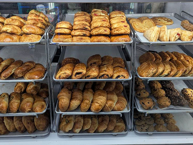 The pastry case reveals layers upon layers of buttery possibility. Each croissant a testament to the simple pleasure of taking your time with breakfast.
