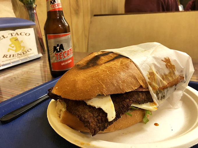 The Cubano torta&mdash;where bread meets meat in a sandwich so substantial it deserves its own zip code. Tecate standing by for backup.