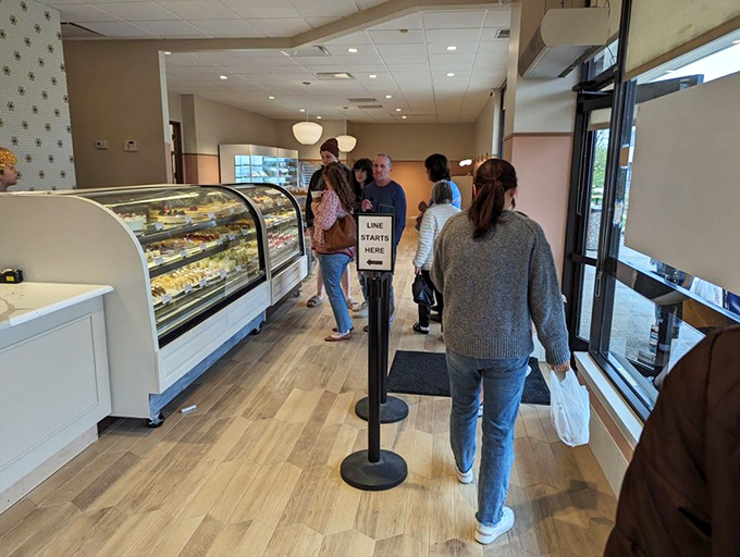 The universal language of anticipation&mdash;customers patiently waiting for their turn at the display case. Some decisions are worth contemplating with reverence.