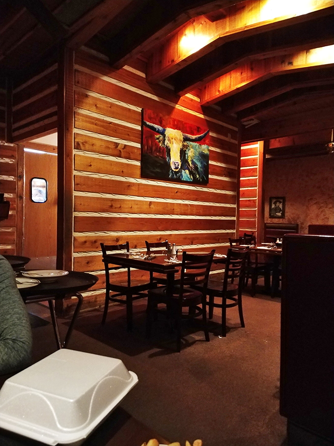 Rustic wooden walls and colorful artwork create the perfect backdrop for meat-induced happiness. Dining rooms with personality are always in style.