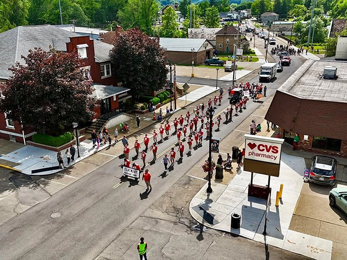 The Dennison Railroad Festival parade marches through town, a colorful reminder that community celebrations still matter in an increasingly disconnected world.