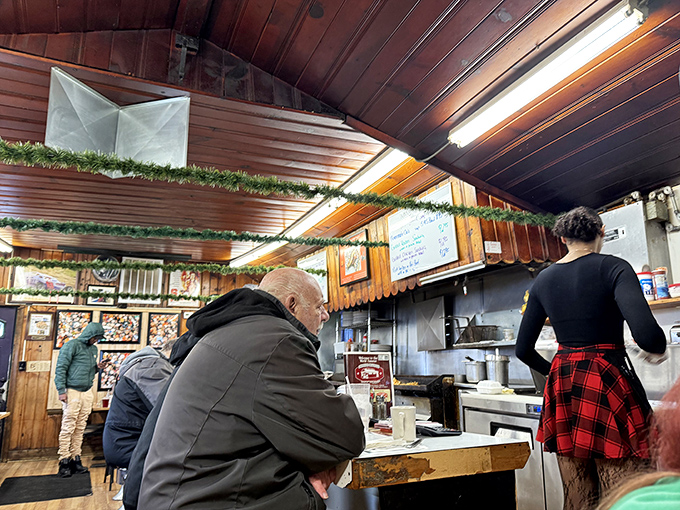The morning congregation at the Church of Breakfast. Wooden ceiling beams watch over devoted diners making their pancake pilgrimages.