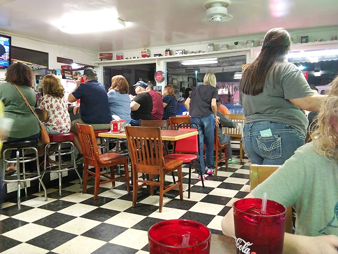 The lunch rush isn't just about eating; it's a community gathering where stories are shared over red plastic cups of sweet tea.