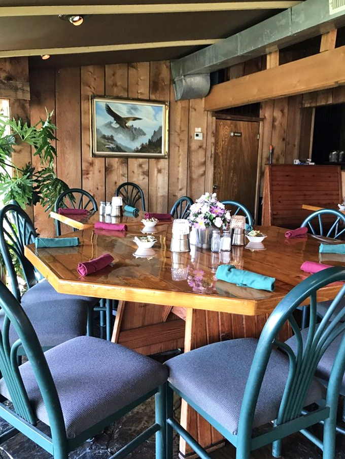 Dining tables arranged for conversation, not for selfies—where the eagle on the wall has witnessed countless celebrations.