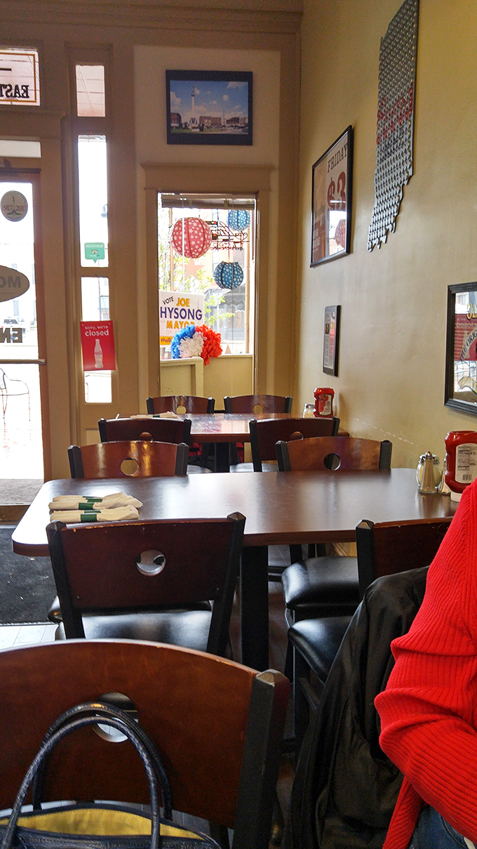 The dining area's warm wood tones and local memorabilia create an atmosphere where calories don't count and diet plans go to die a delicious death. 