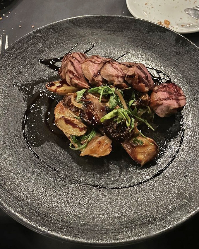 Duck breast cooked to pink perfection, sliced to showcase its rosy interior&mdash;proof that not all poultry dishes are created equal.