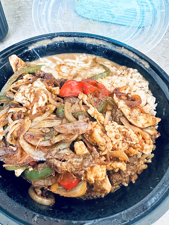 Sizzling fajitas in their natural habitat&mdash;a steaming black skillet where peppers, onions, and perfectly seasoned meat become best friends.