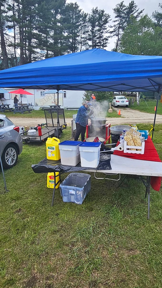 The universal language of comfort food speaks volumes at this market stand, where steam carries promises of satisfaction.