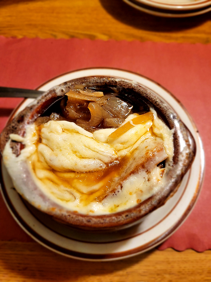 French onion soup that's fought and won the battle between cheese stretch and spoon access. Those caramelized onions didn't rush to perfection.