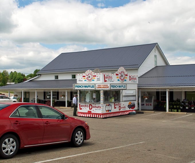 Lerch's Donuts stand proves that sometimes the most memorable culinary experiences come from simple white buildings with red-striped awnings.