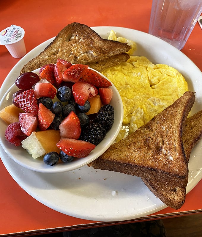 A breakfast that understands balance &ndash; golden French toast, fluffy eggs, and fruit that makes you feel virtuous about your indulgence.