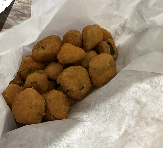 Fried okra: the South's gift to the Midwest. These golden nuggets convert even the most stubborn okra skeptics with their crispy, savory charm.