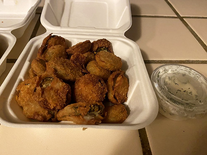 Fried pickles: crunchy, tangy little discs of happiness that disappear faster than your New Year's resolutions at a dessert buffet.