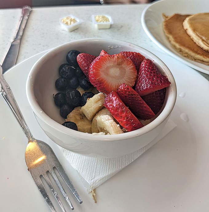 Fresh fruit that somehow tastes better in a diner bowl. Perhaps it's the pancakes waiting just out of frame.
