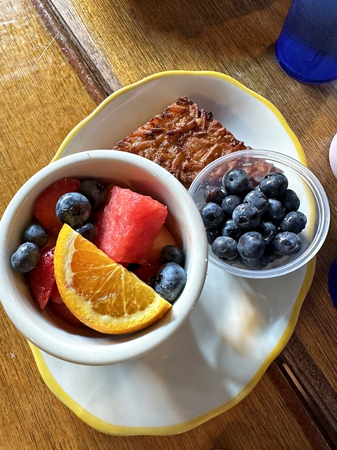 Fresh fruit and a potato latke sharing a plate&mdash;the breakfast equivalent of having both an angel and devil on your shoulders.