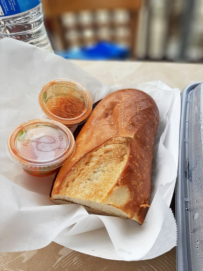 Crusty sourdough bread served with dipping sauces &ndash; because sometimes you need a brief intermission between acts of seafood brilliance.