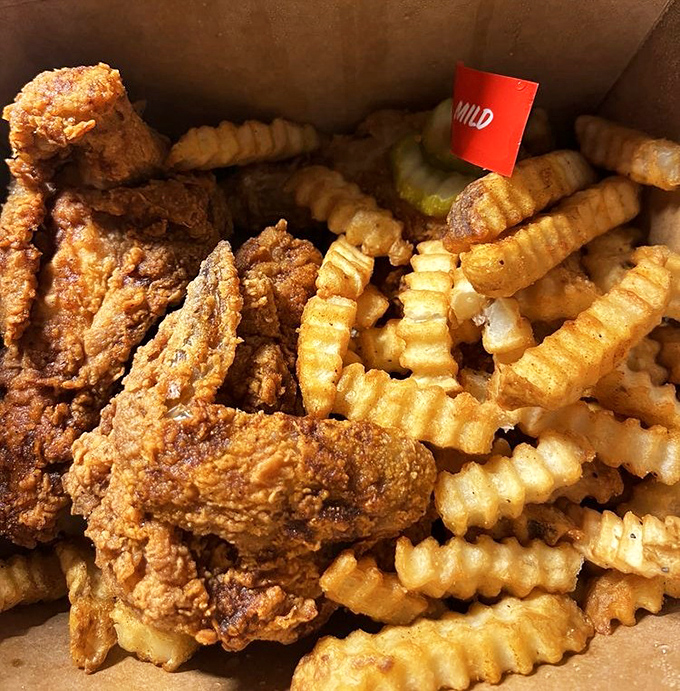 Tender meets crispy in this box of golden-brown joy. The little red flag isn't decoration—it's your heat level warning and badge of courage.